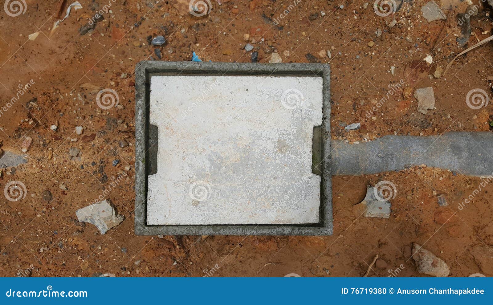 Concrete manhole on ground stock photo. Image of cover - 76719380