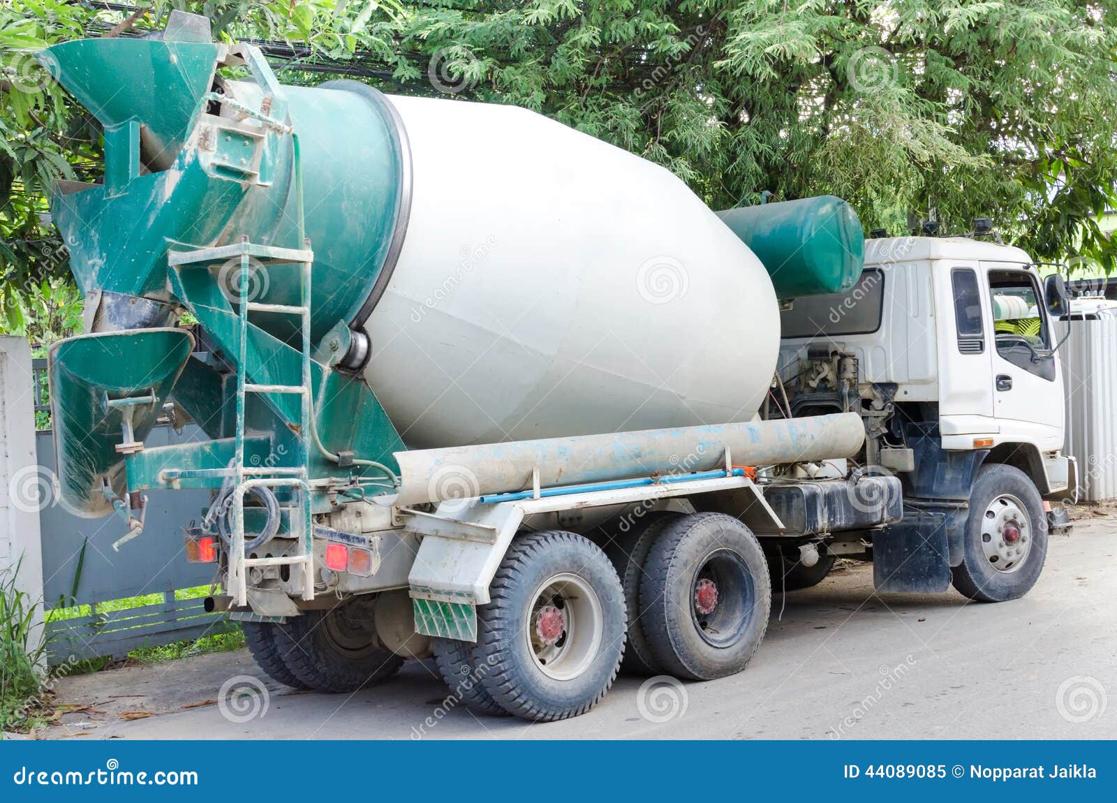 Concrete Mixer Truck with Green Cab Over Trees Stock Image - Image of ...