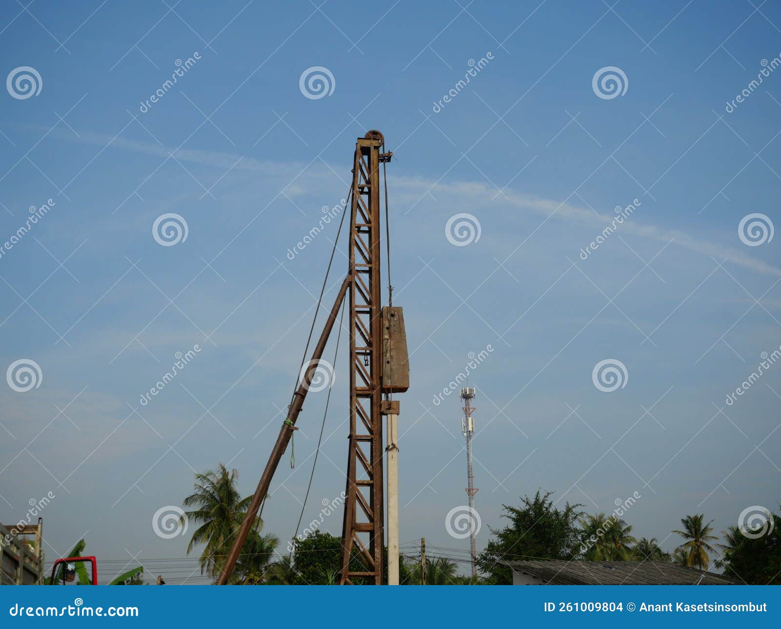 Concrete Pile is Being Driven into the Ground at Construction Site ...