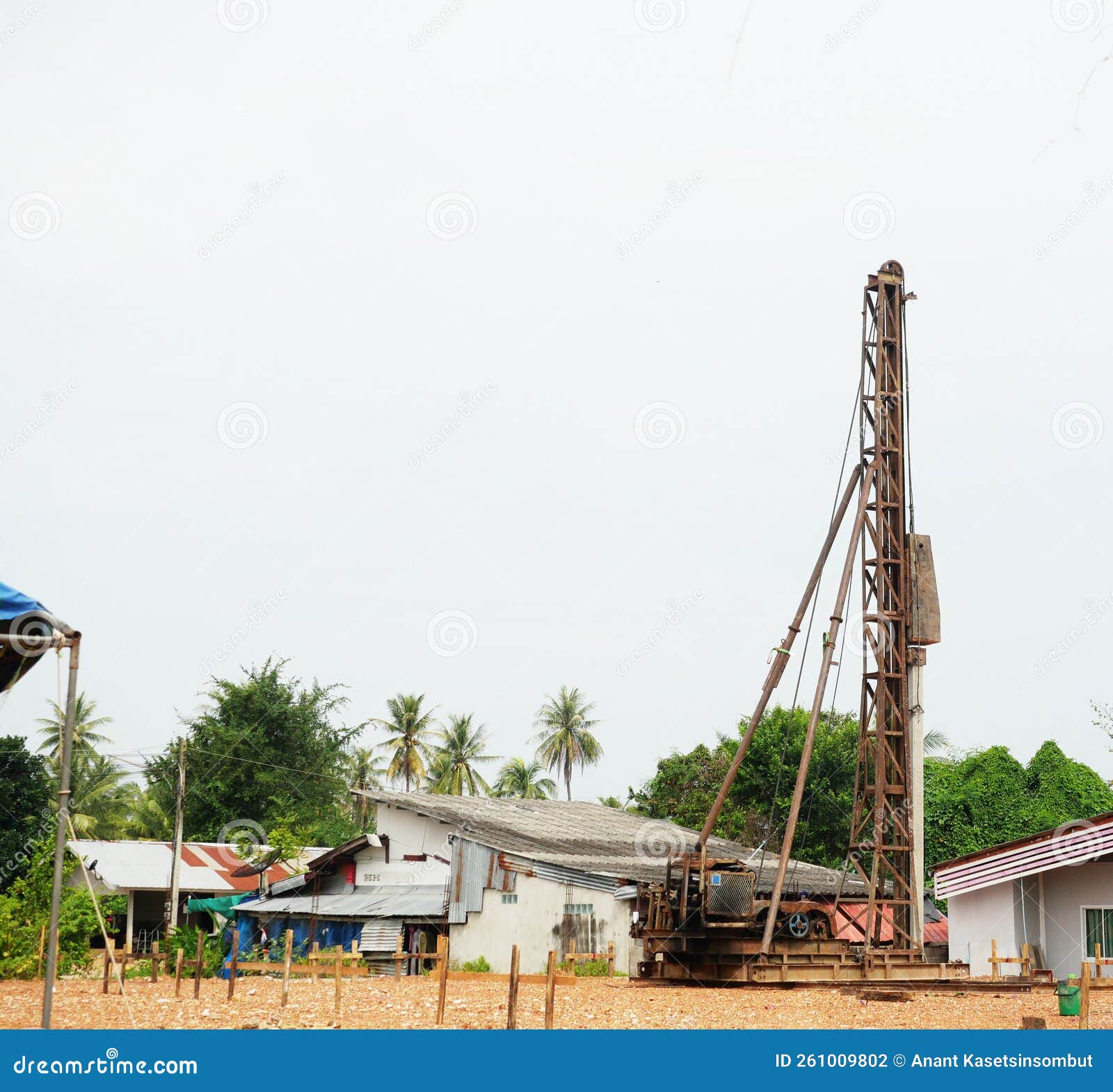 Concrete Pile is Being Driven into the Ground at Construction Site ...