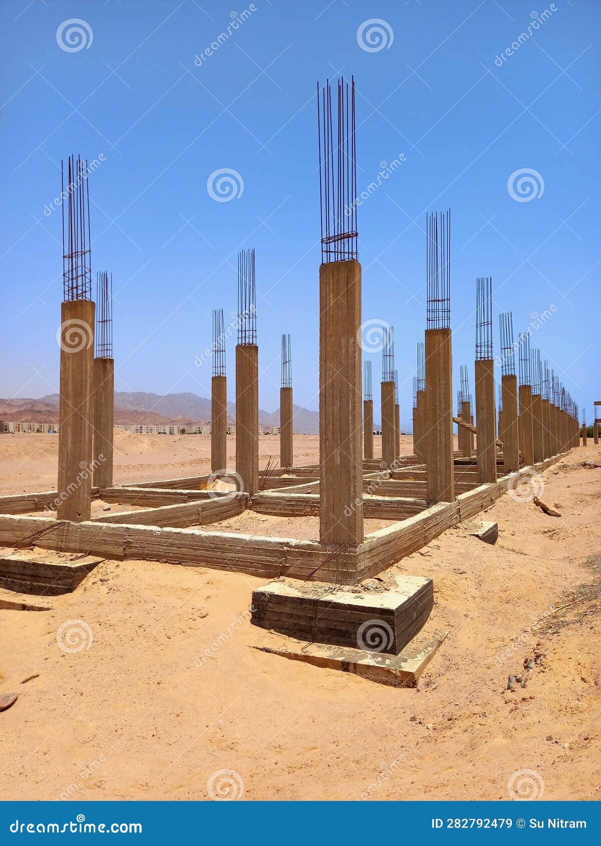 Concrete Pillars in the Desert Under Blue Sky. Building Foundations in ...