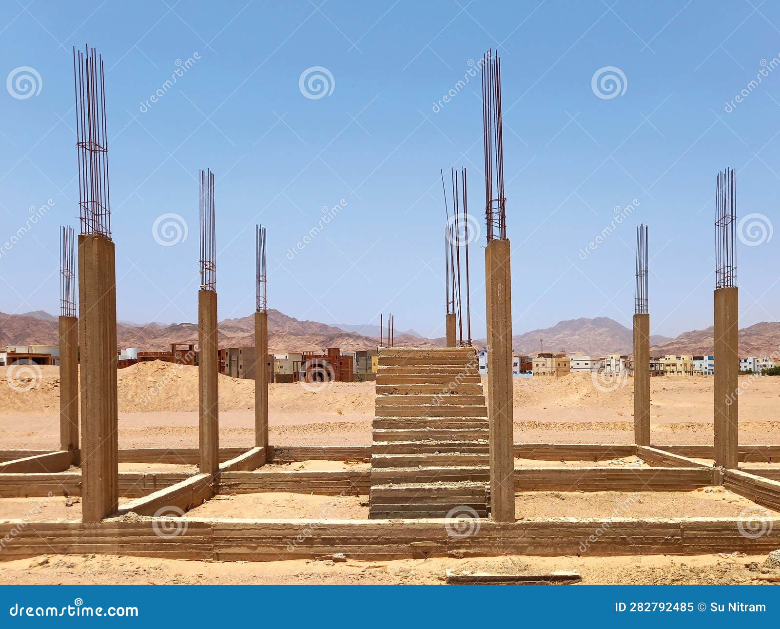 Concrete Pillars in the Desert Under Blue Sky. Building Foundations in ...
