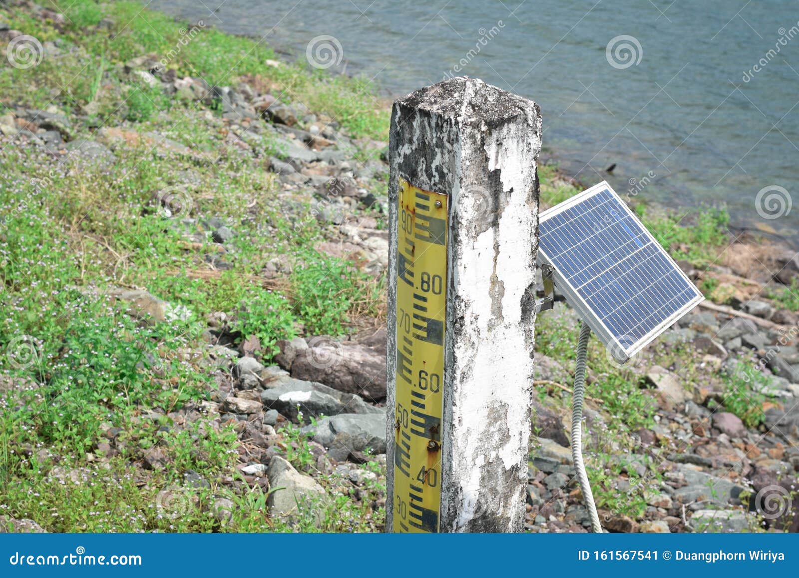 A Concrete Pole Measures Water Level and Solar Cell Panel in Dam ...