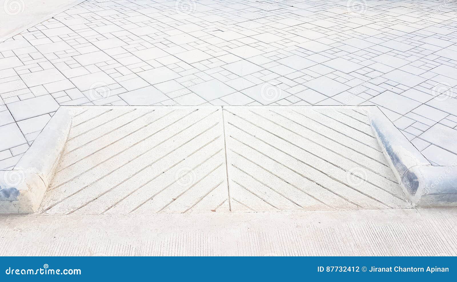 Concrete Ramp with the Above Square Brick Walkway Stock Photo - Image ...