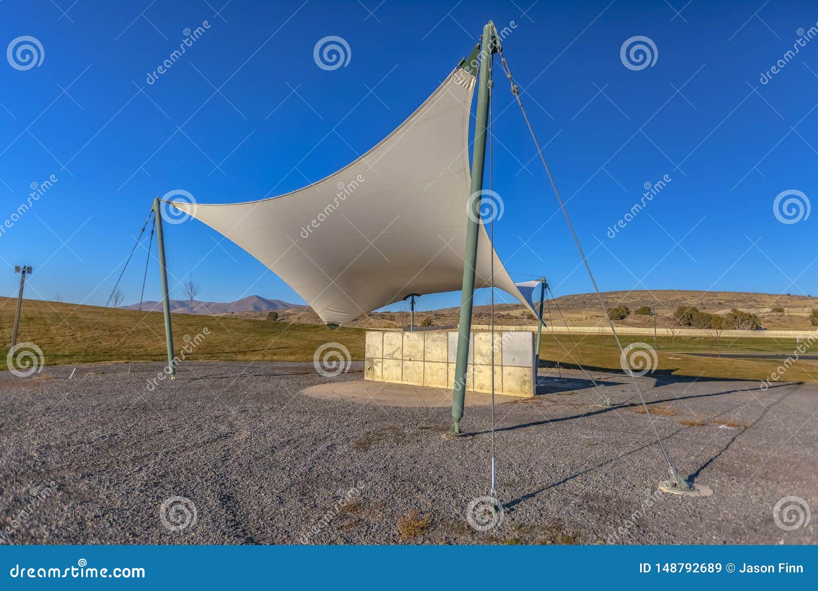 Concrete Rectangular Structure Under a White Canopy Viewed on a Sunny ...