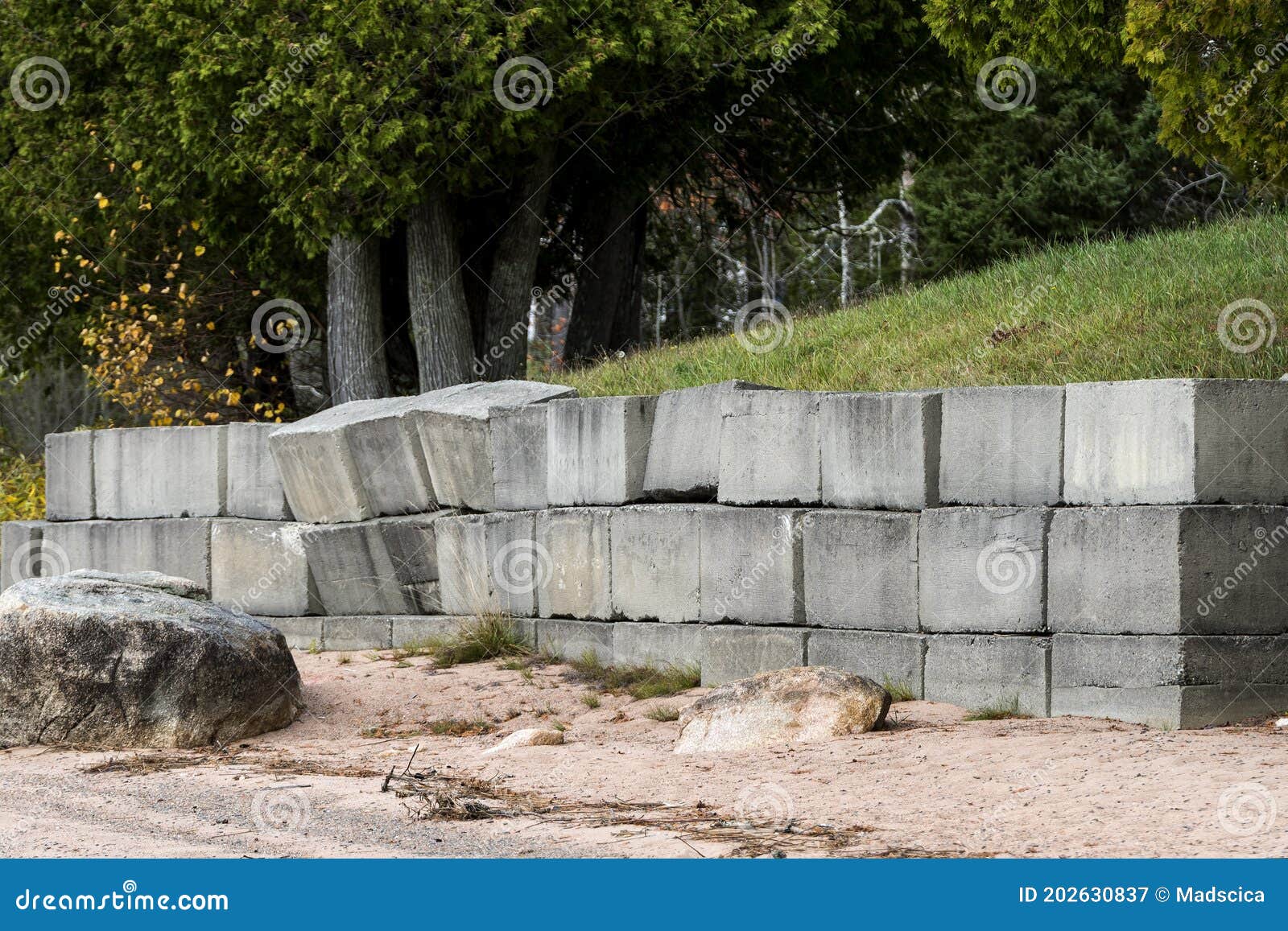 A Concrete Retaining Wall that is Falling Over Stock Image - Image of ...