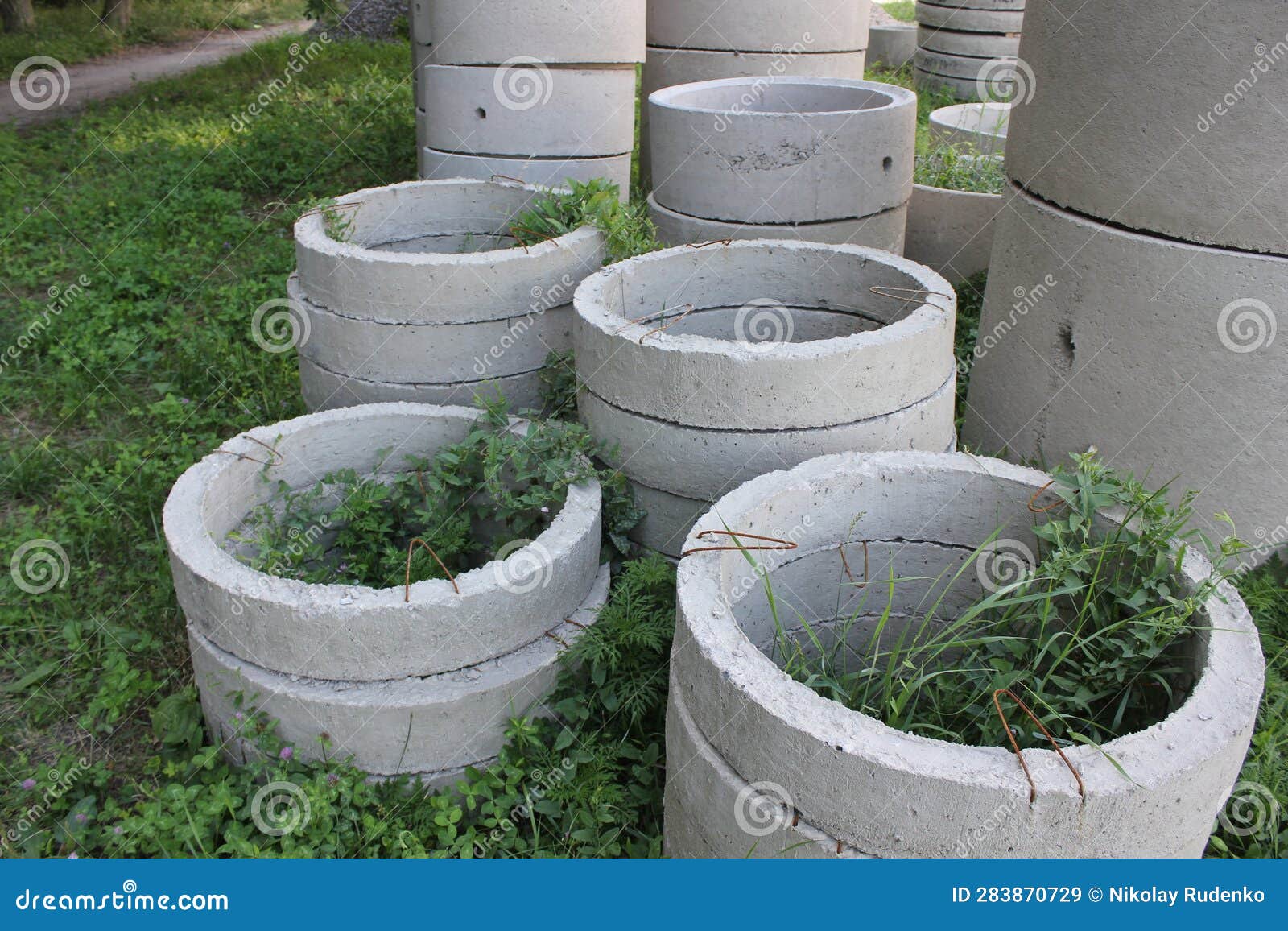 Concrete Rings Stacked on Grassy Surface Stock Image - Image of lawn ...