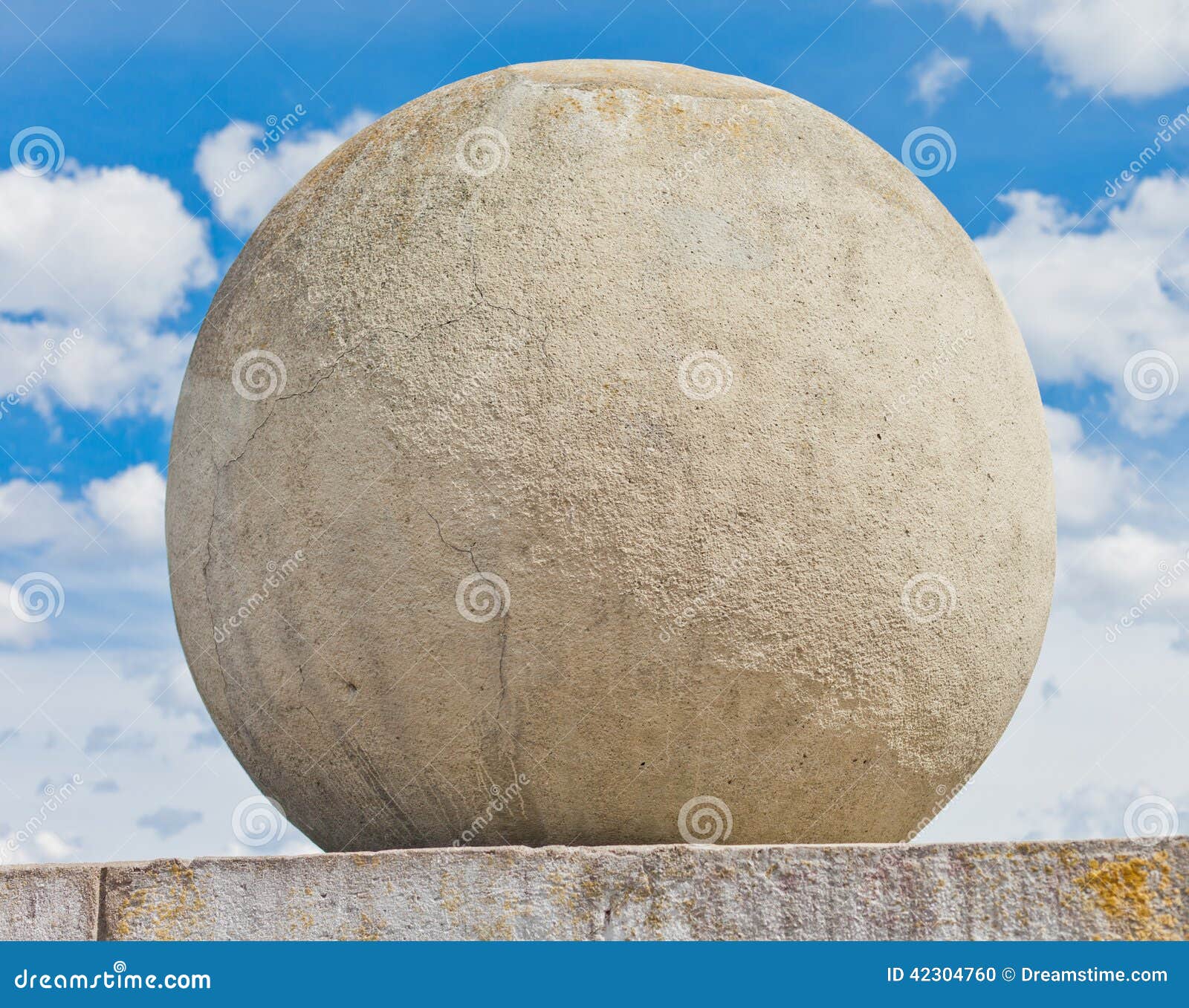 Concrete Sphere Partially Covered With Moss Mounted On Top Of Concrete ...