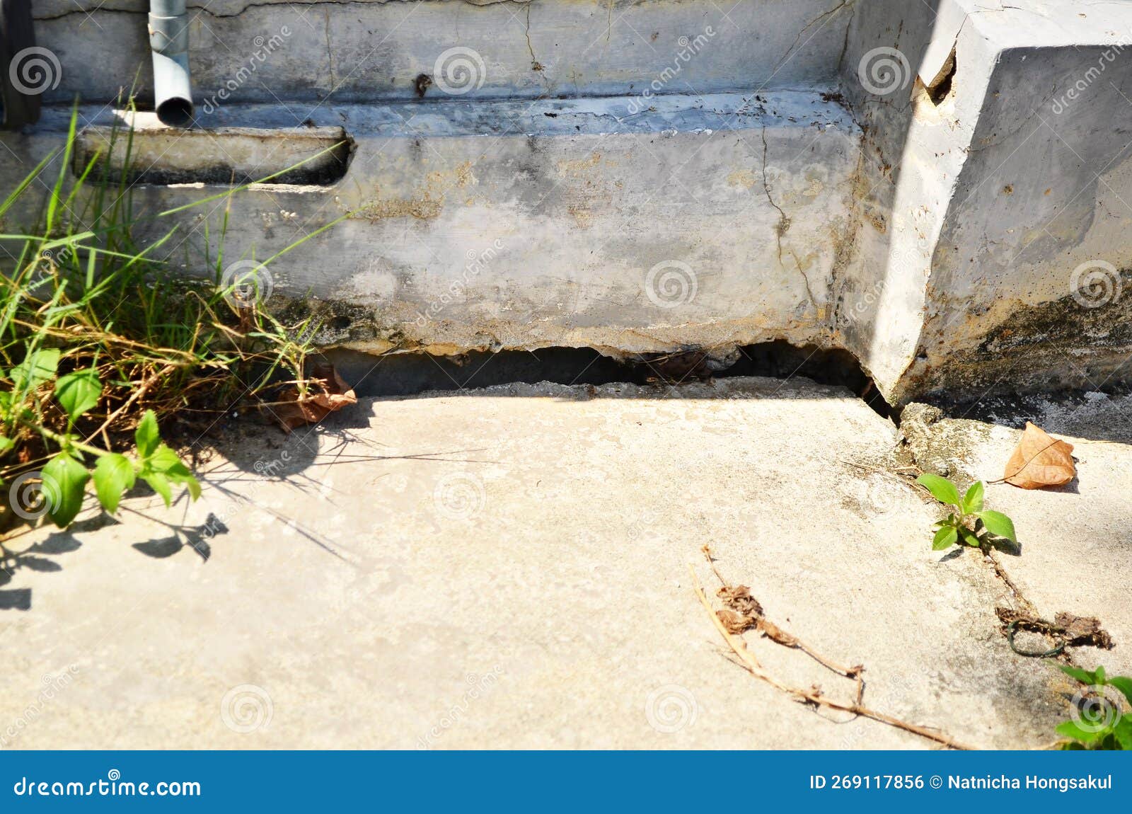 The Cement Structure of the House Collapsed into a Gap. Stock Photo ...