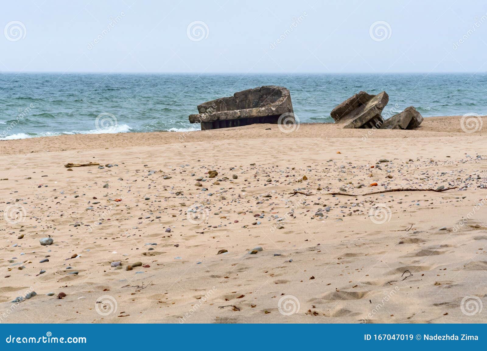 Concrete Structures on the Beach, Construction Debris on the Shore ...
