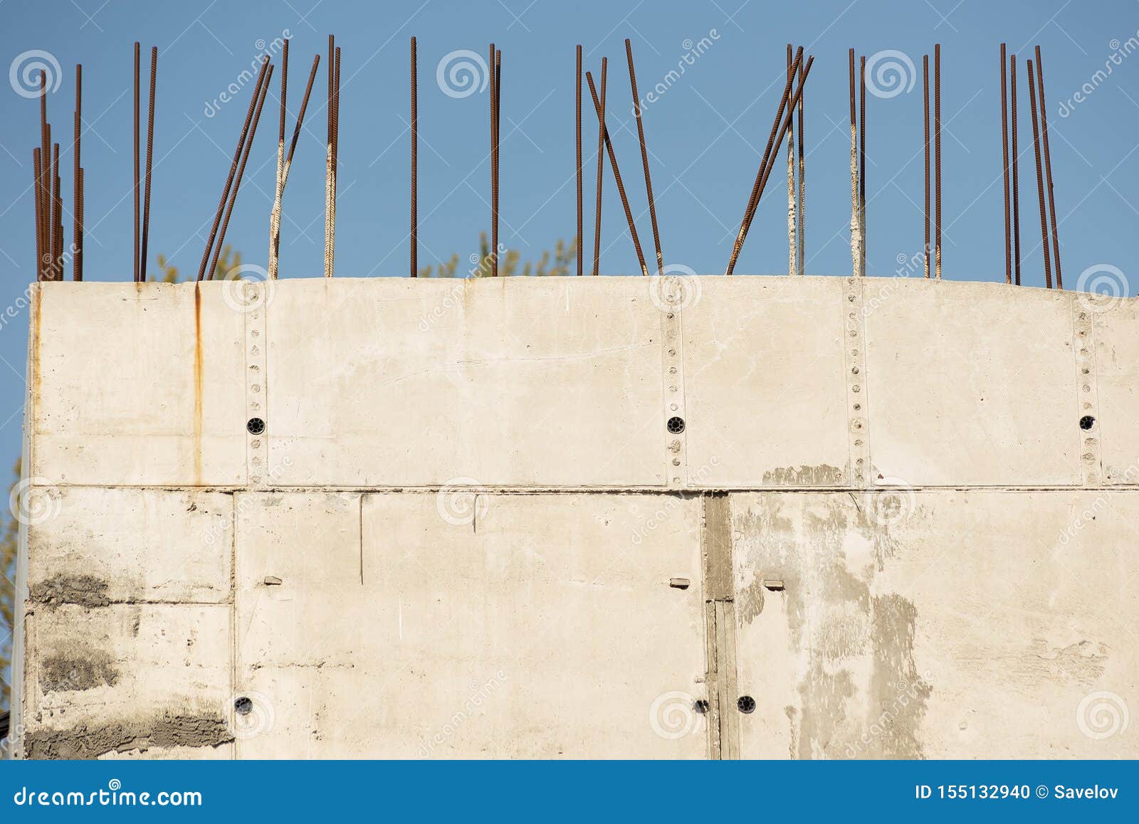 Concrete Wall with Metal Threaded Rod Against the Sky Stock Photo ...