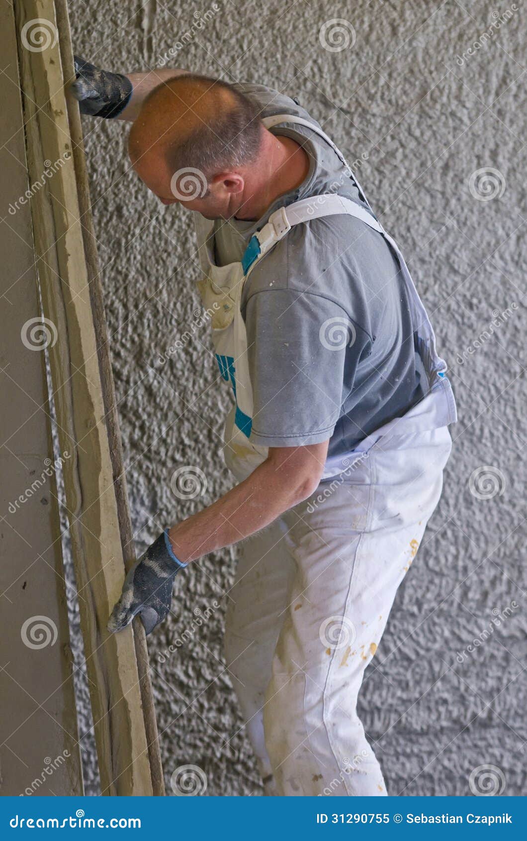 Concrete wall worker stock image. Image of finishing - 31290755