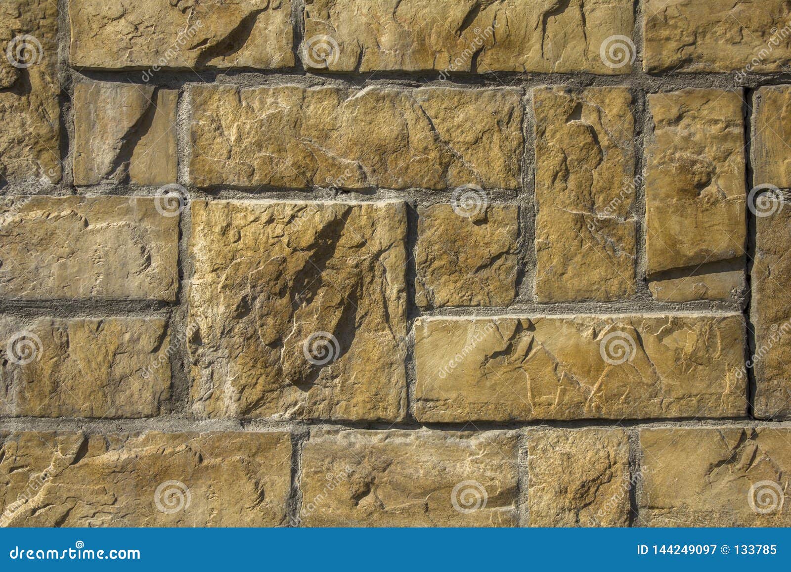Concrete Wall of Yellow Stone Square and Rectangular Bricks of ...