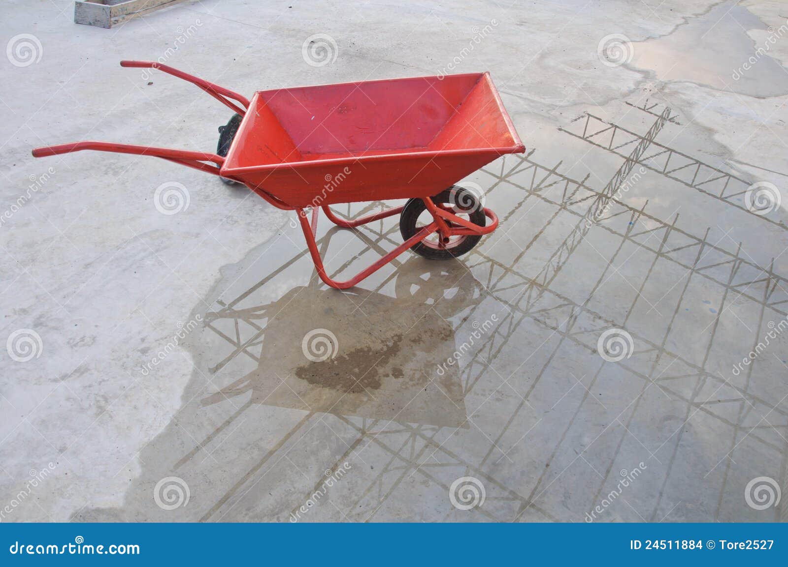 Concrete wheel barrow stock photo. Image of site, water - 24511884