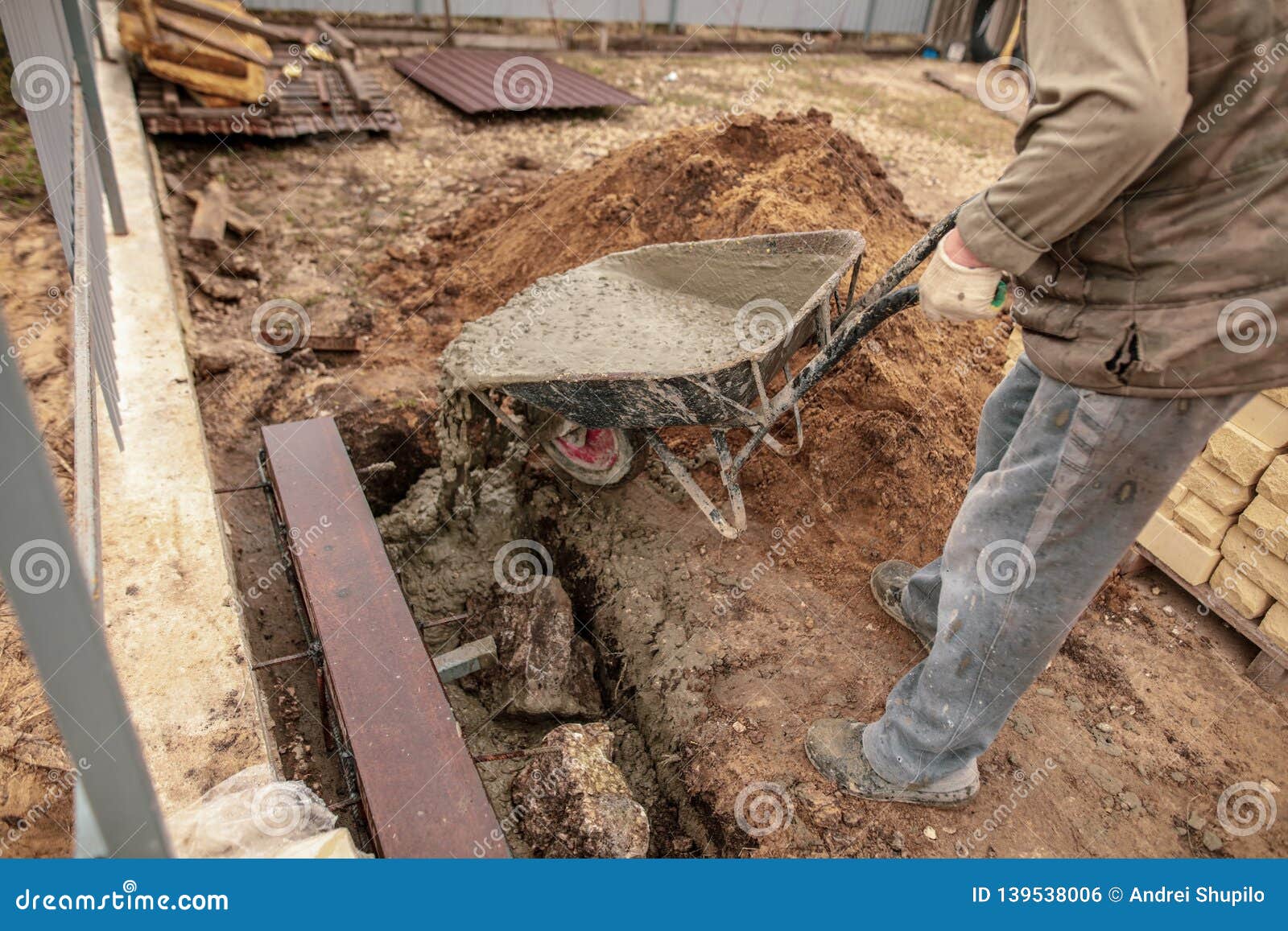 Concrete in a Wheelbarrow at a Construction Site Stock Photo - Image of ...