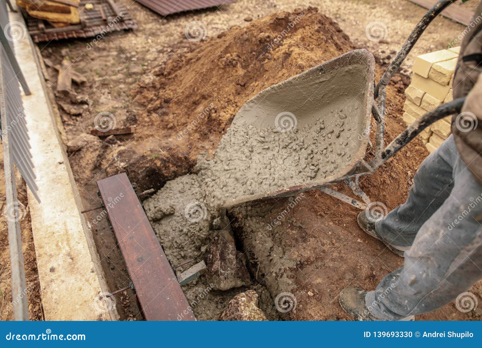 Concrete in a Wheelbarrow at a Construction Site Stock Photo - Image of ...