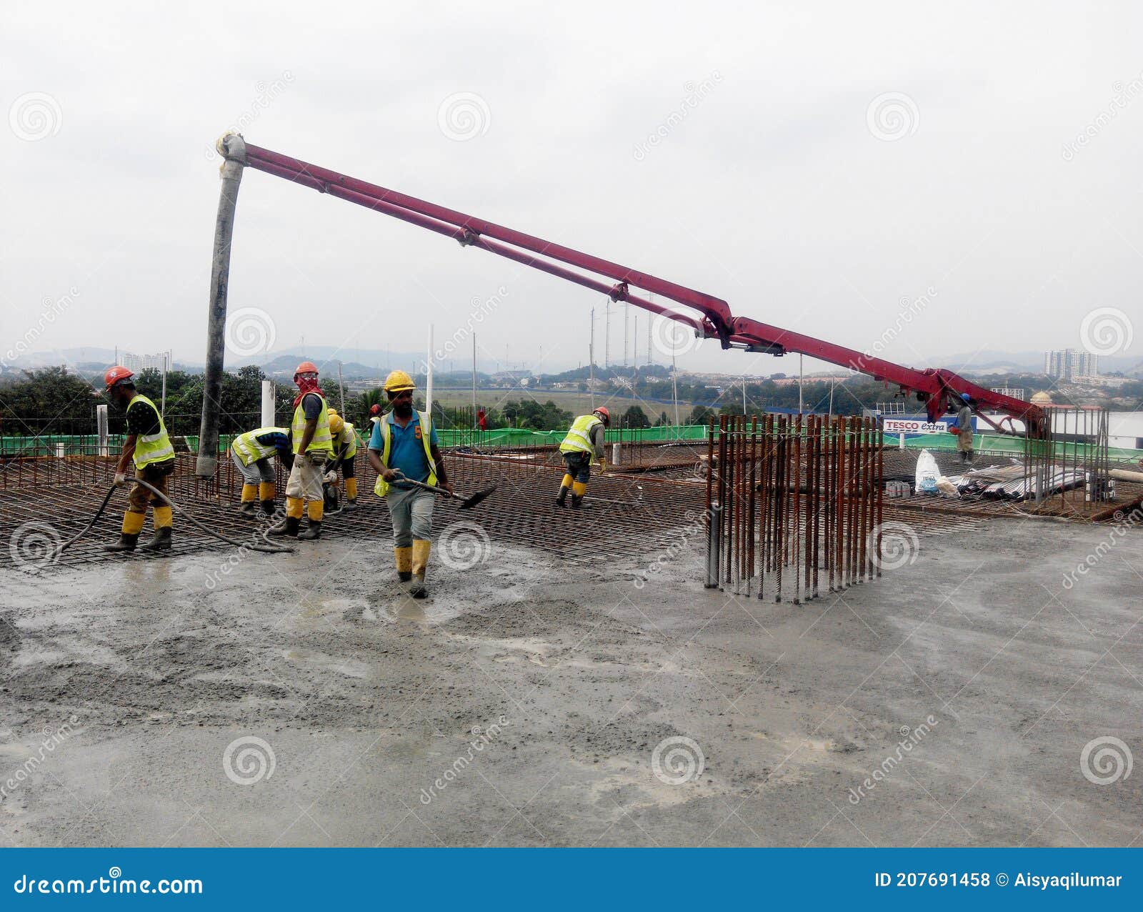 Concreting Work By Construction Workers At The Construction Site ...