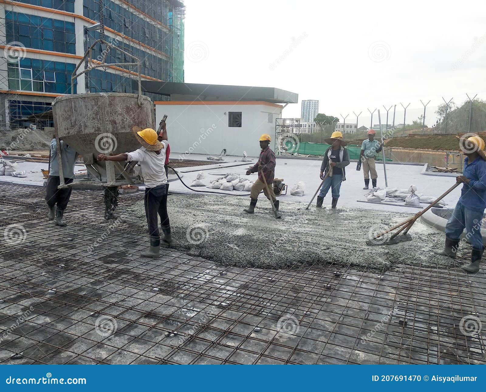Concreting Work by Construction Workers at the Construction Site ...