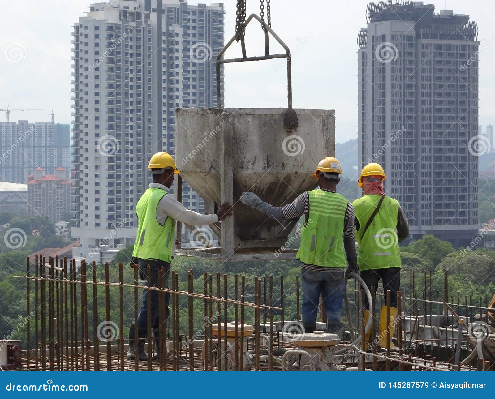 Concreting Work by Construction Workers at the Construction Site ...