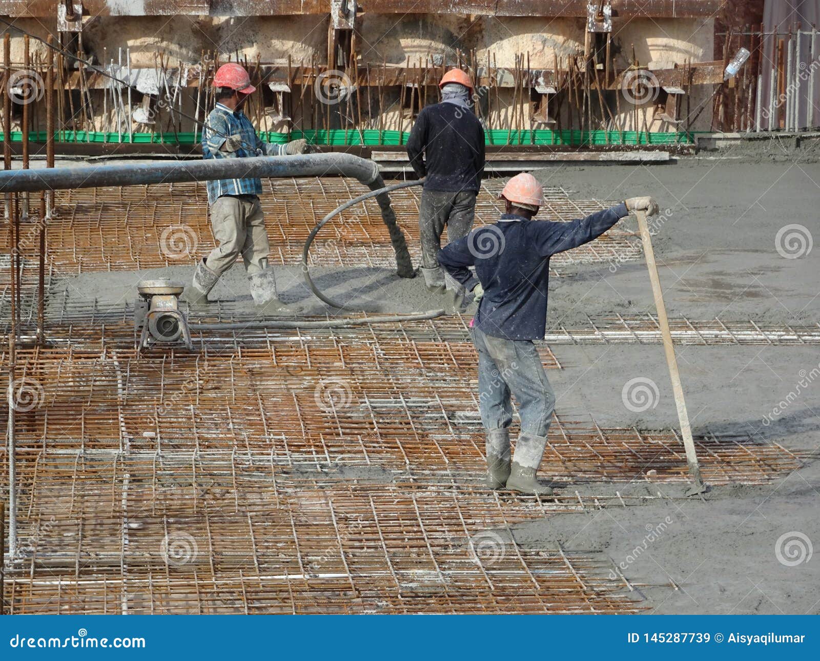 Concreting Work by Construction Workers at the Construction Site ...