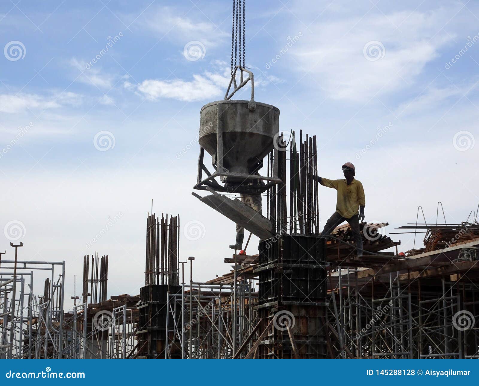 Concreting Work by Construction Workers at the Construction Site ...