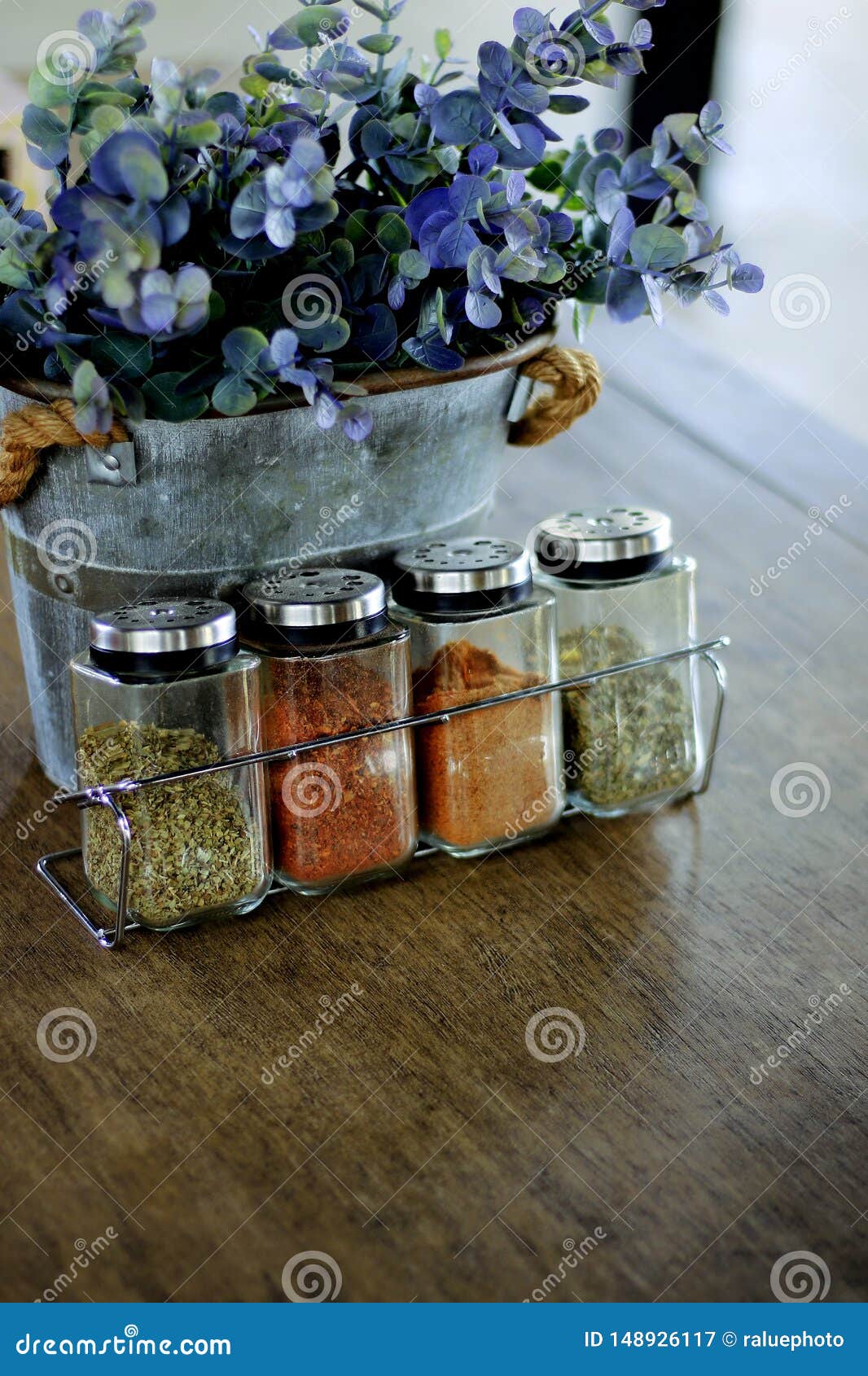 Condiment Set with a Vase of Flowers on the Table Stock Image - Image ...