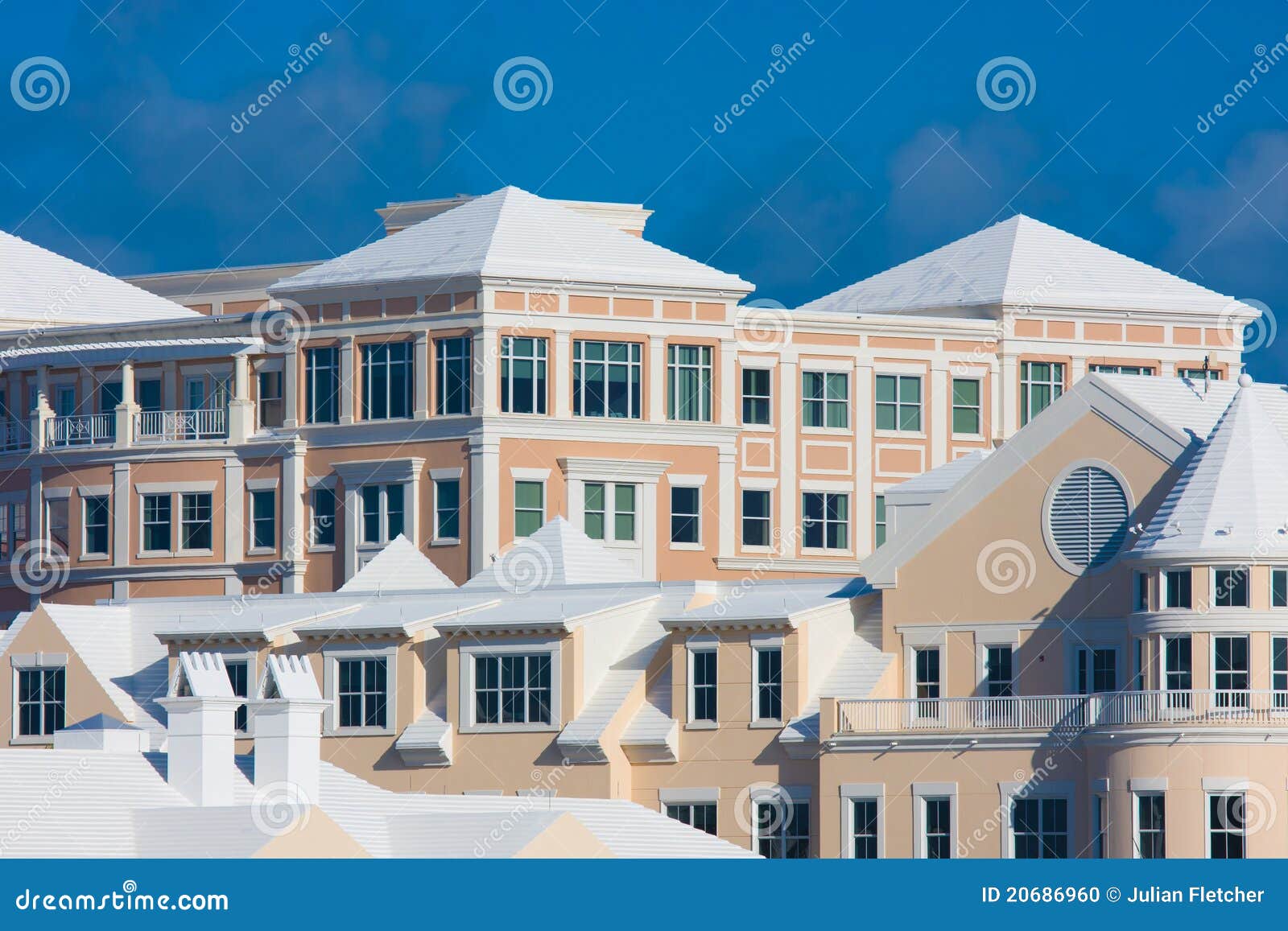 Condominiums in Bermuda stock photo. Image of clock, construction ...