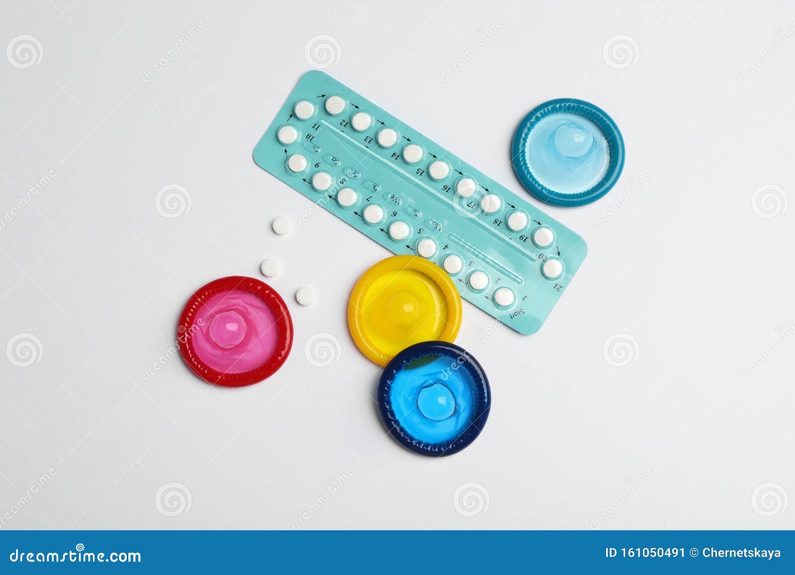 Condoms And Birth Control Pills On Grey Background Flat Lay Safe Sex Concept Stock Image