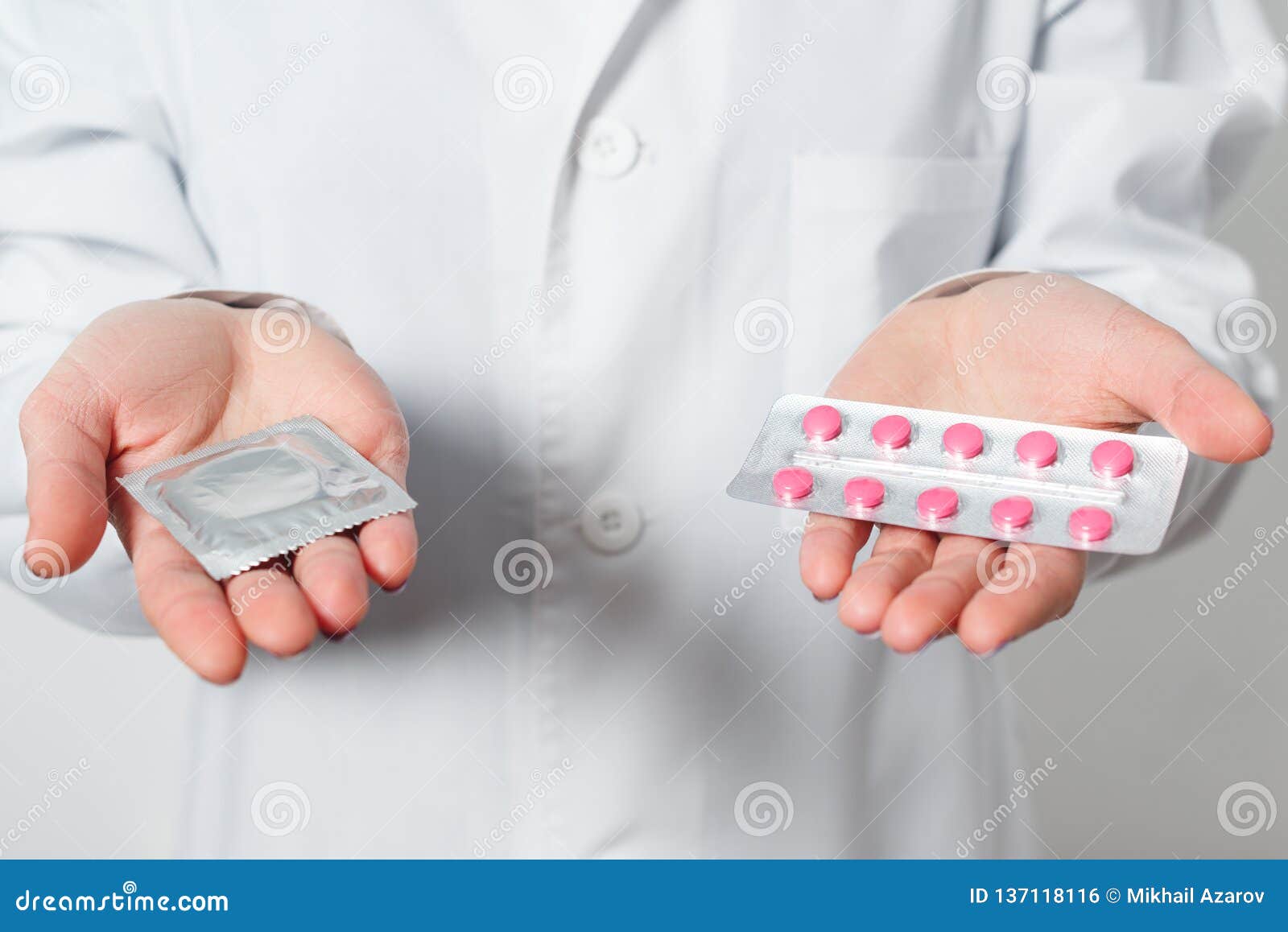 Condoms And Contraceptives In The Hands Of A Doctor For Safe Sex Stock