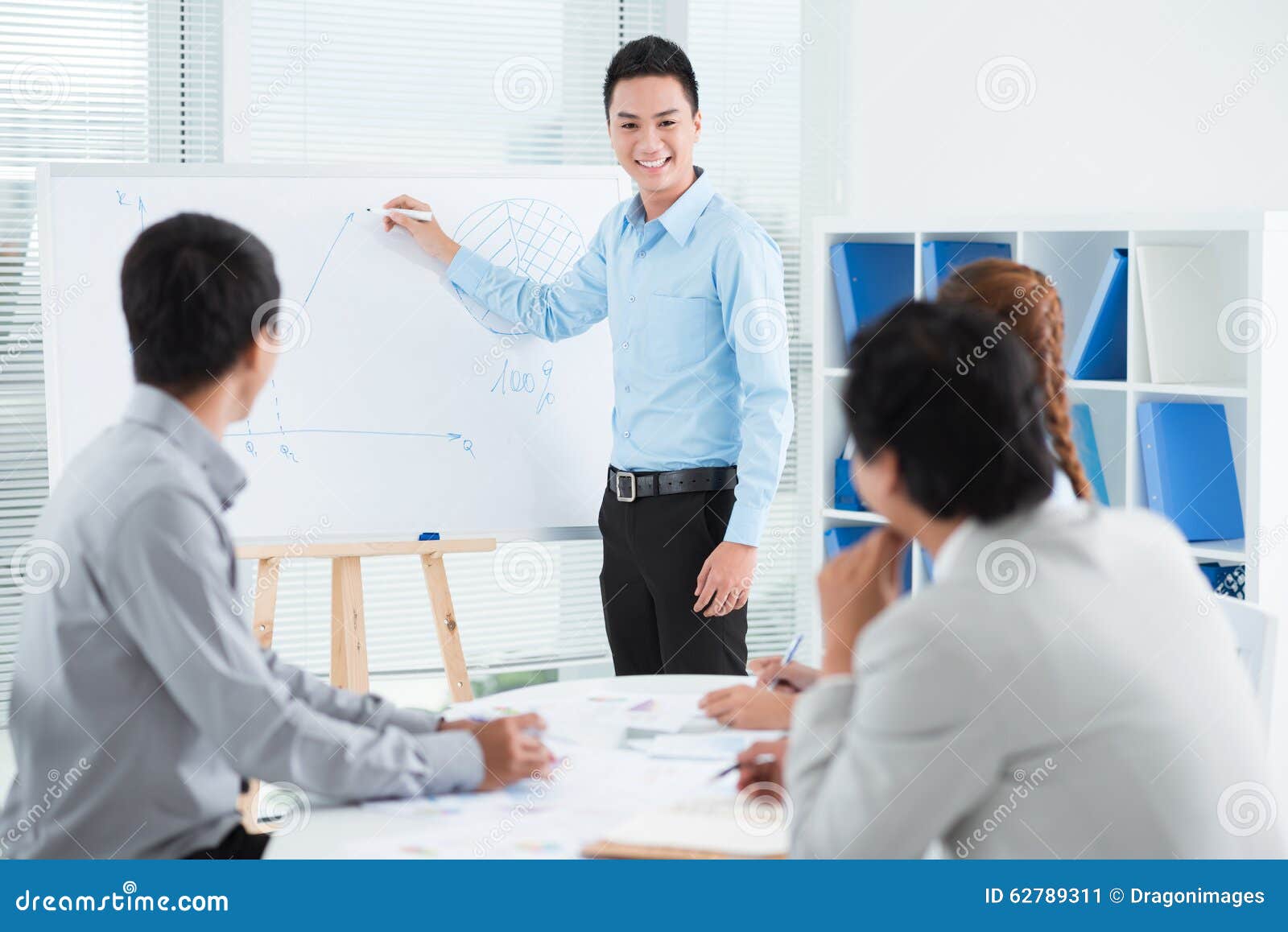 Conducting presentation stock image. Image of smiling - 62789311