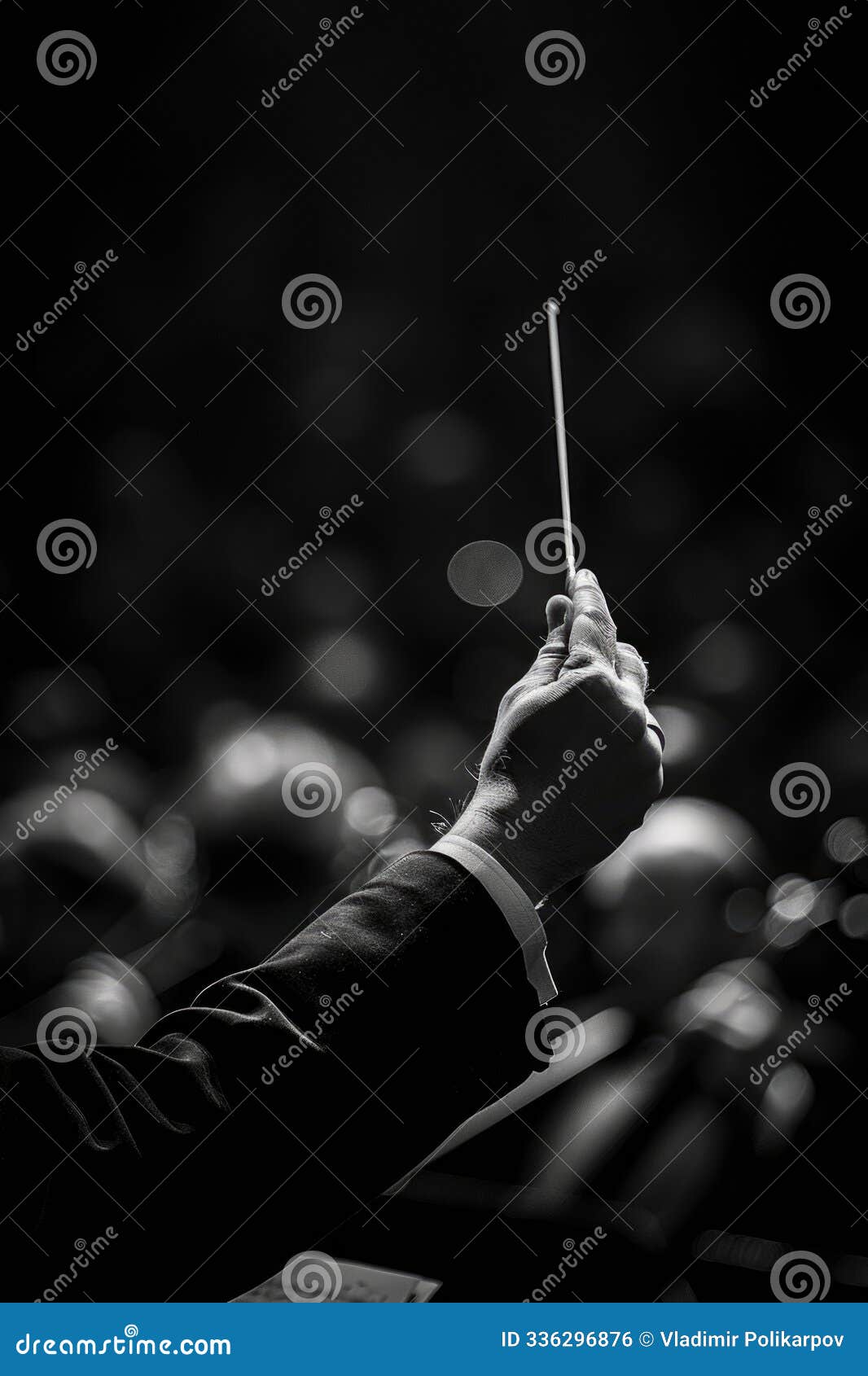 A Conductor Holds a Baton and Leads a Crowd of Musicians in a ...