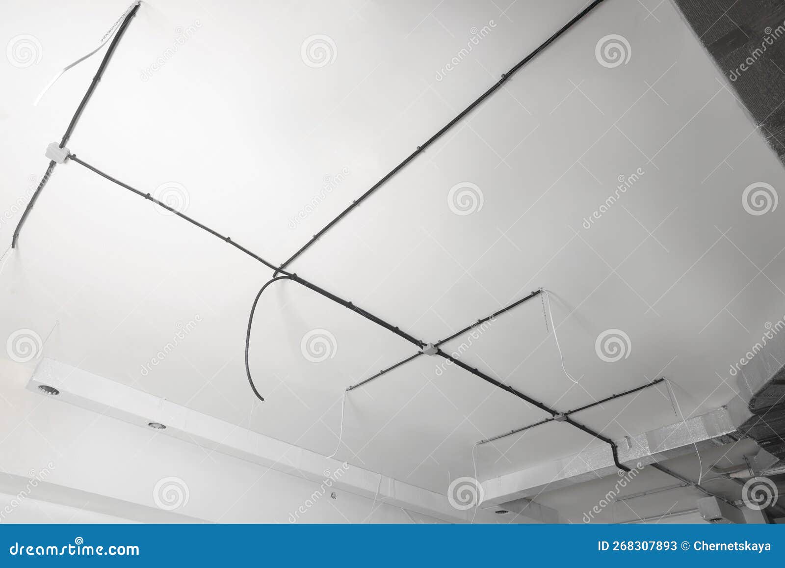 Conduits with Cables and Ventilation System on White Ceiling, Low Angle ...