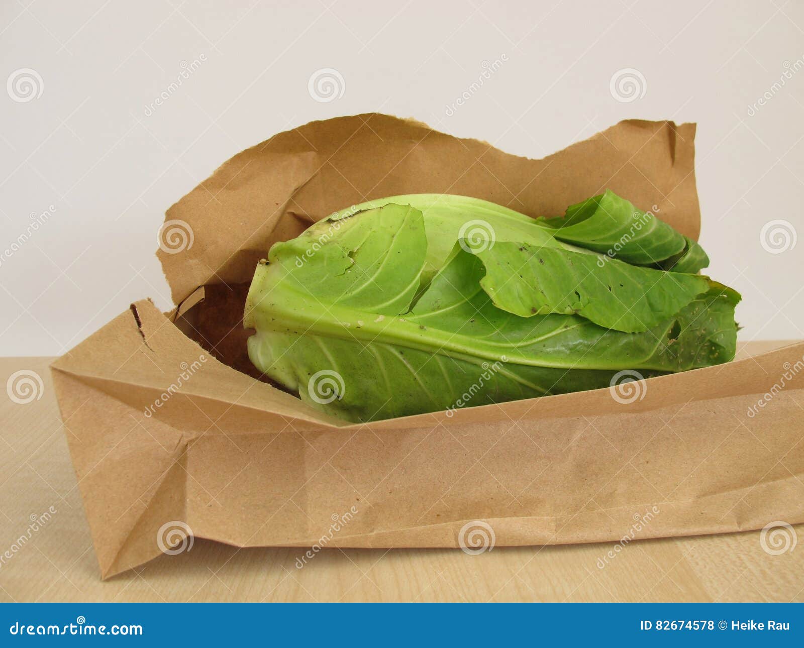 Cone cabbage in paper bag stock photo. Image of cabbage - 82674578