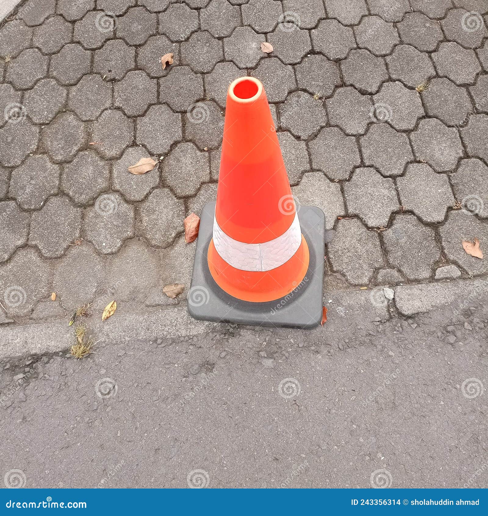 Cone on paving blocks stock photo. Image of pink, pattern - 243356314