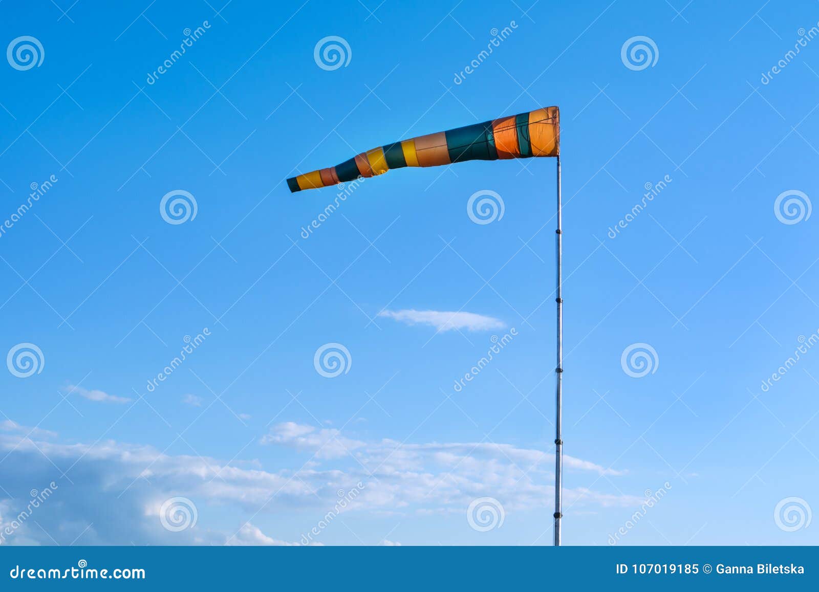 Cone-wind Direction in a Field Against a Blue Sky. Stock Image - Image ...