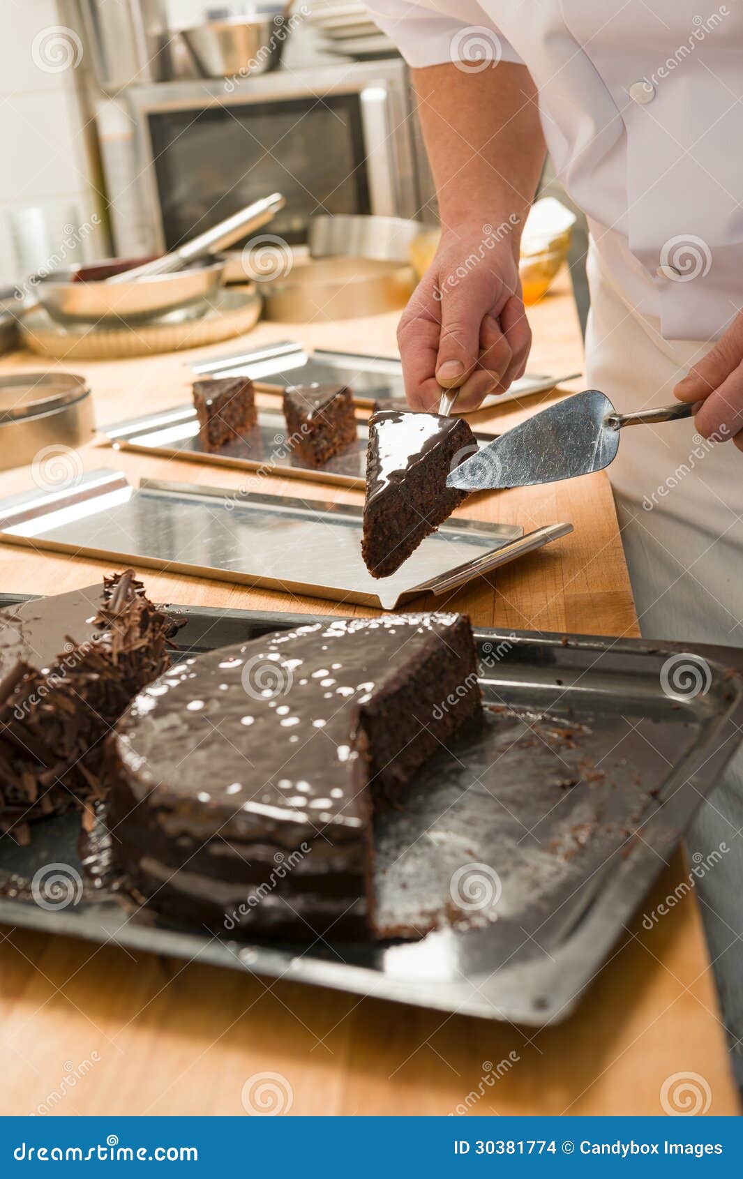 Confectioner Cutting a Slice of Chocolate Cake Stock Photo - Image of ...