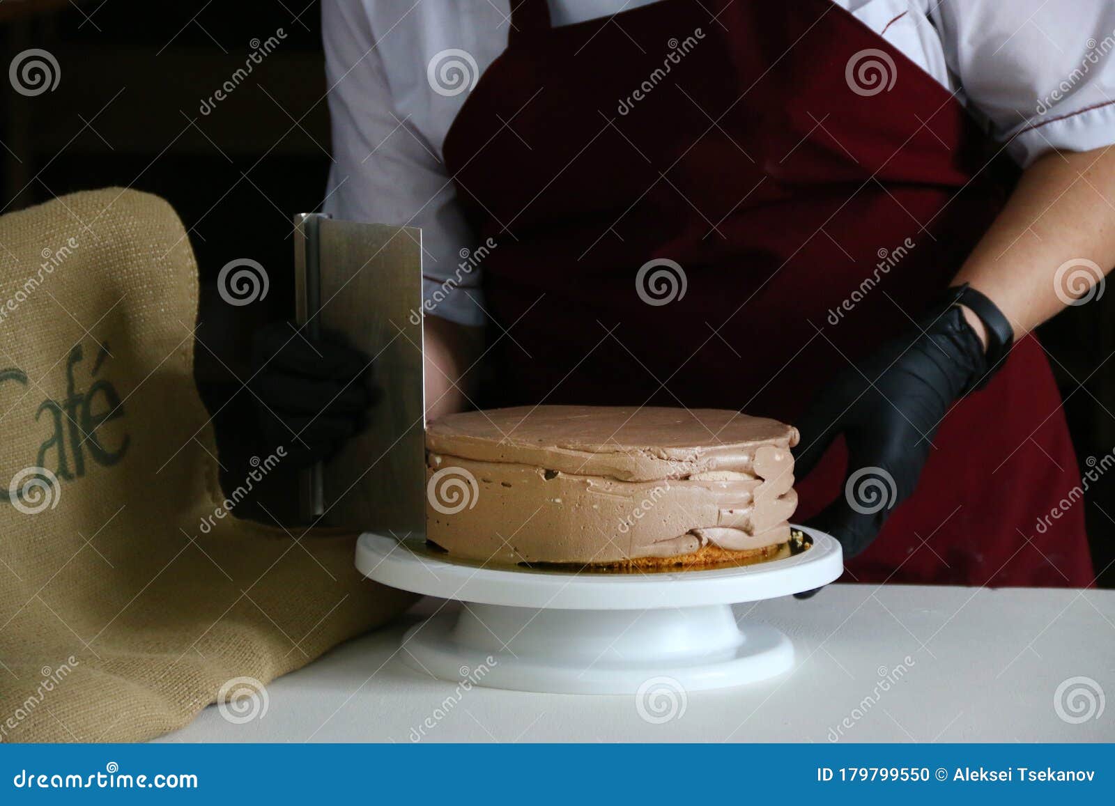 Confectioner Process Chocolate Cake on Table. the Process of Decorating ...