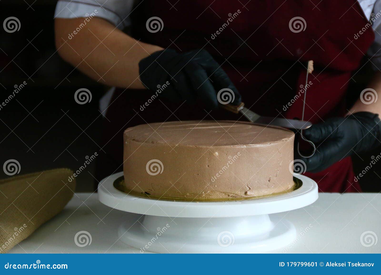 Confectioner Process Chocolate Cake on Table. the Process of Decorating ...