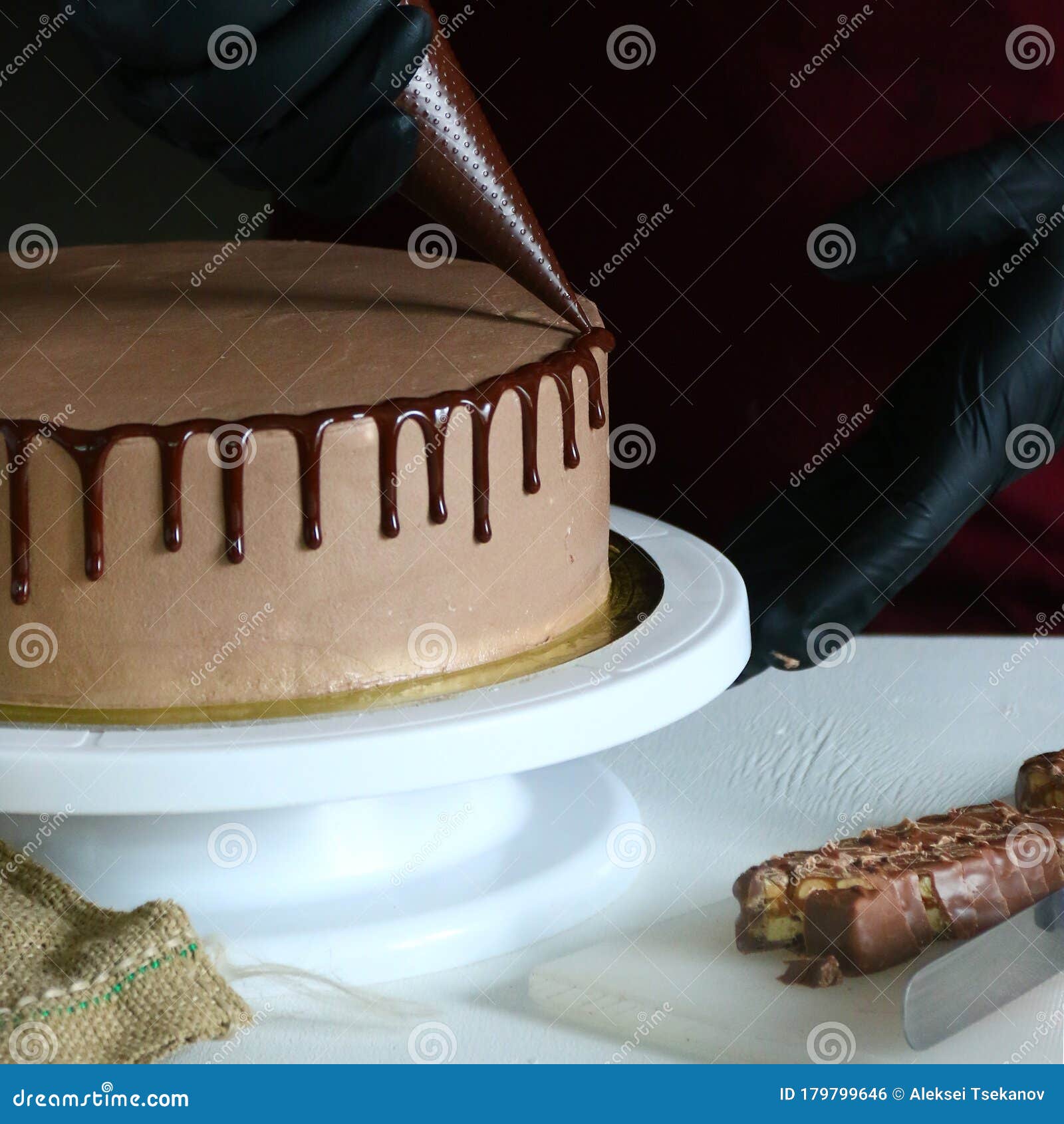 Confectioner Process Chocolate Cake on Table. the Process of Decorating ...