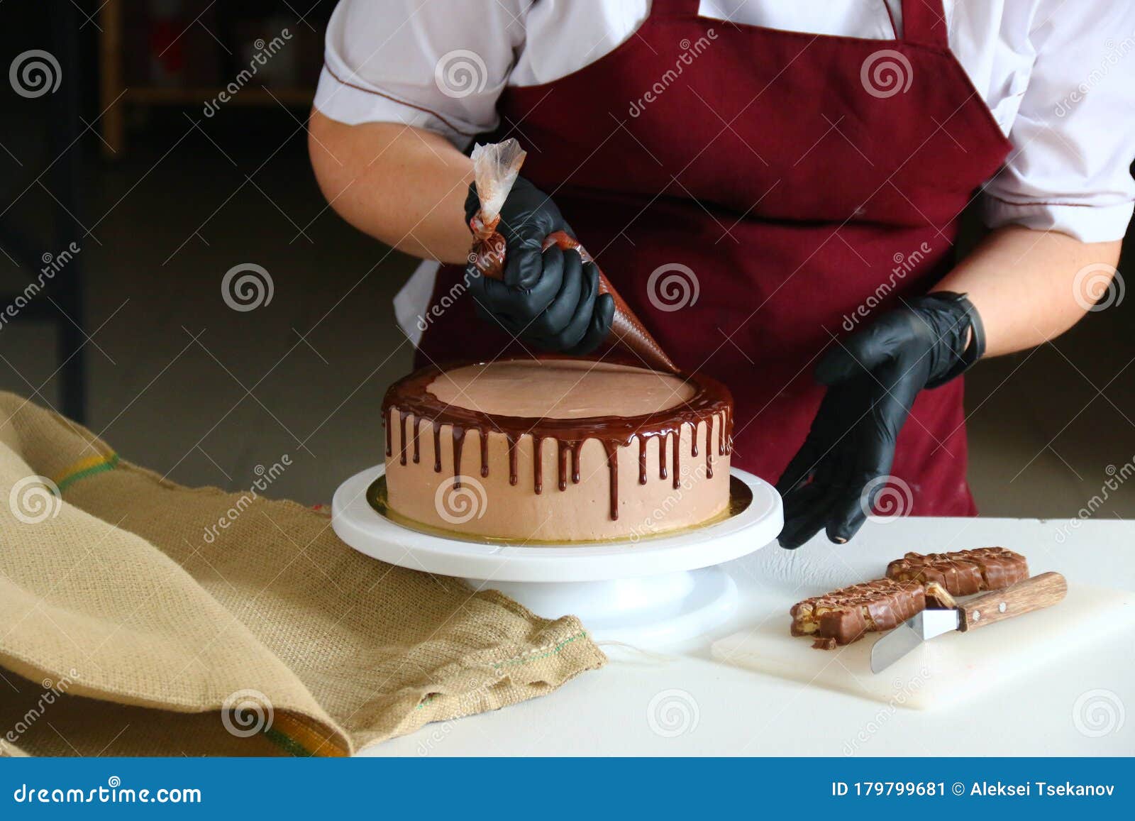 Confectioner Process Chocolate Cake on Table. the Process of Decorating ...