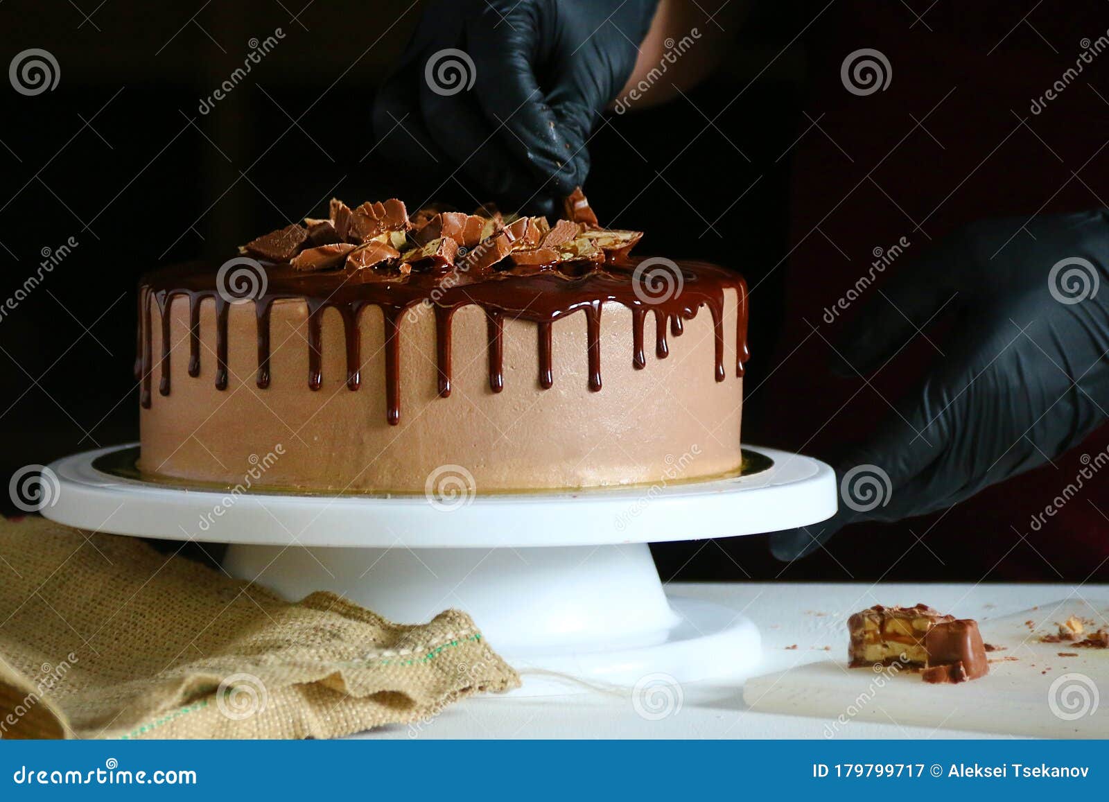 Confectioner Process Chocolate Cake on Table. the Process of Decorating ...