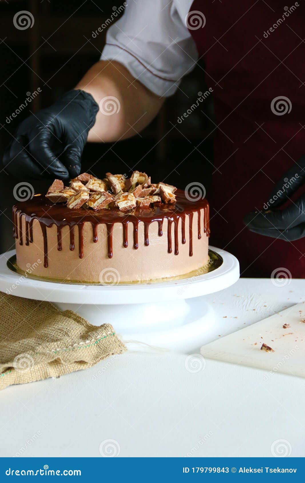 Confectioner Process Chocolate Cake on Table. the Process of Decorating ...