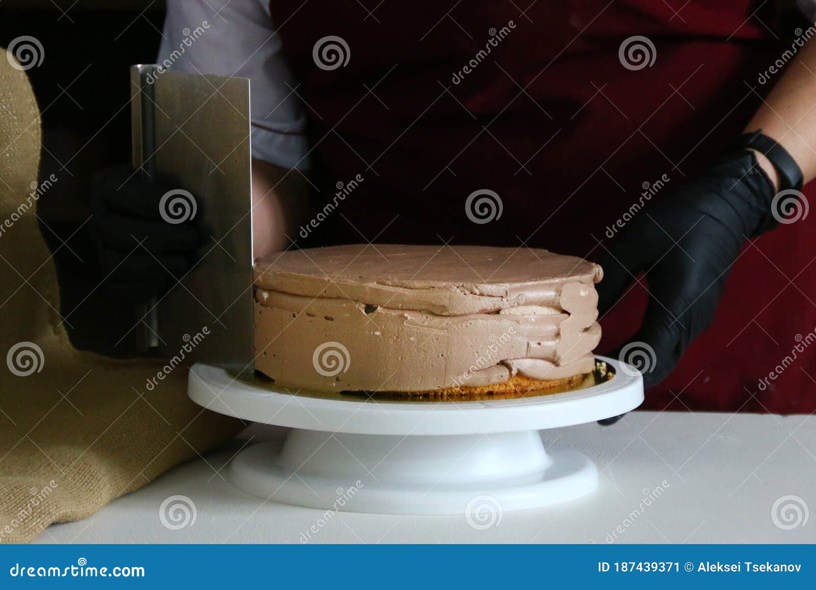 Confectioner Process Chocolate Cake On Table. The Process Of Decorating ...