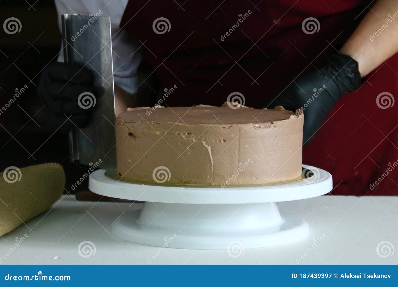 Confectioner Process Chocolate Cake on Table. the Process of Decorating ...