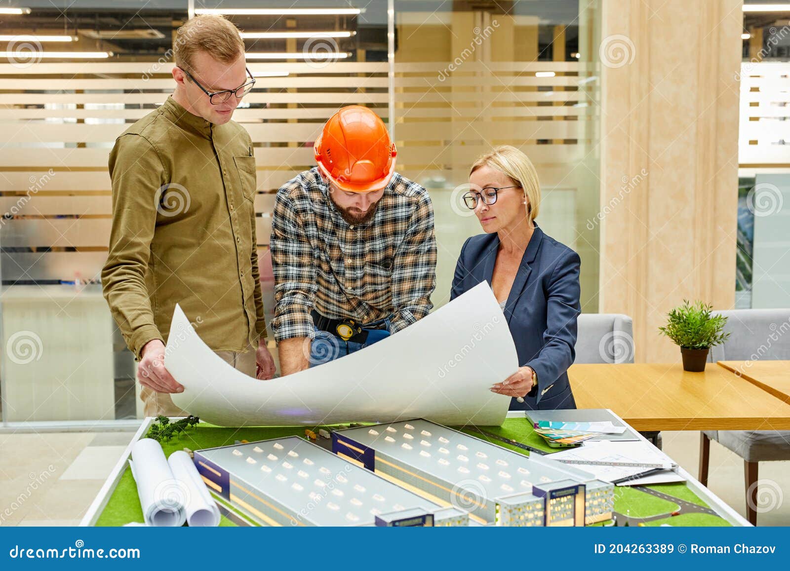 Confident Architect Man Show Plan for Building To Leading Engineers ...