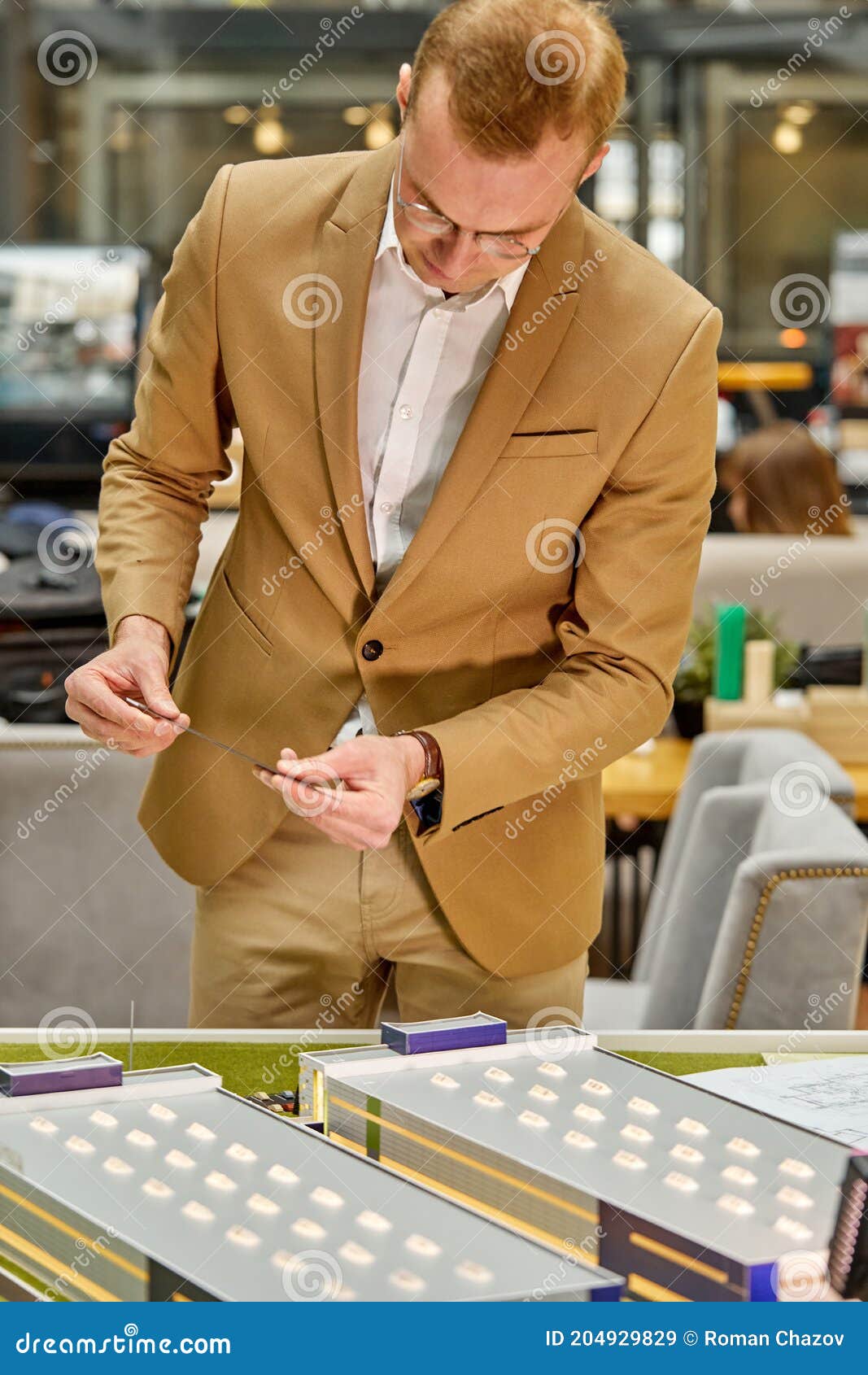 Confident Architect Man Working in Office with Drawings and Building ...