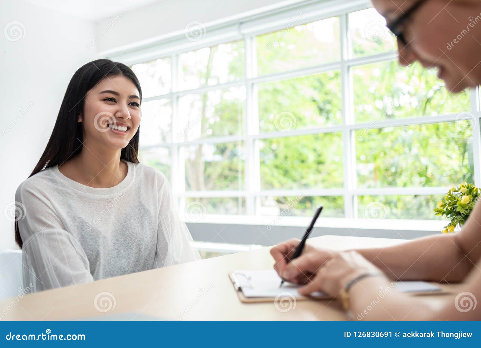 Confident Asian Female Employee is Smiling during the Job Interview ...