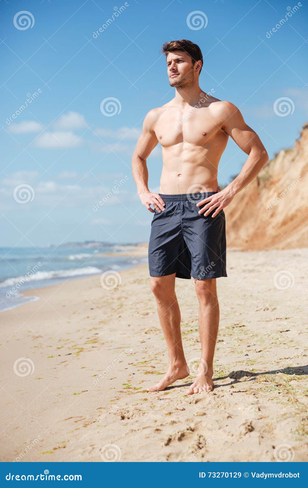 Confident Athletic Young Man Standing on the Beach Stock Image - Image ...