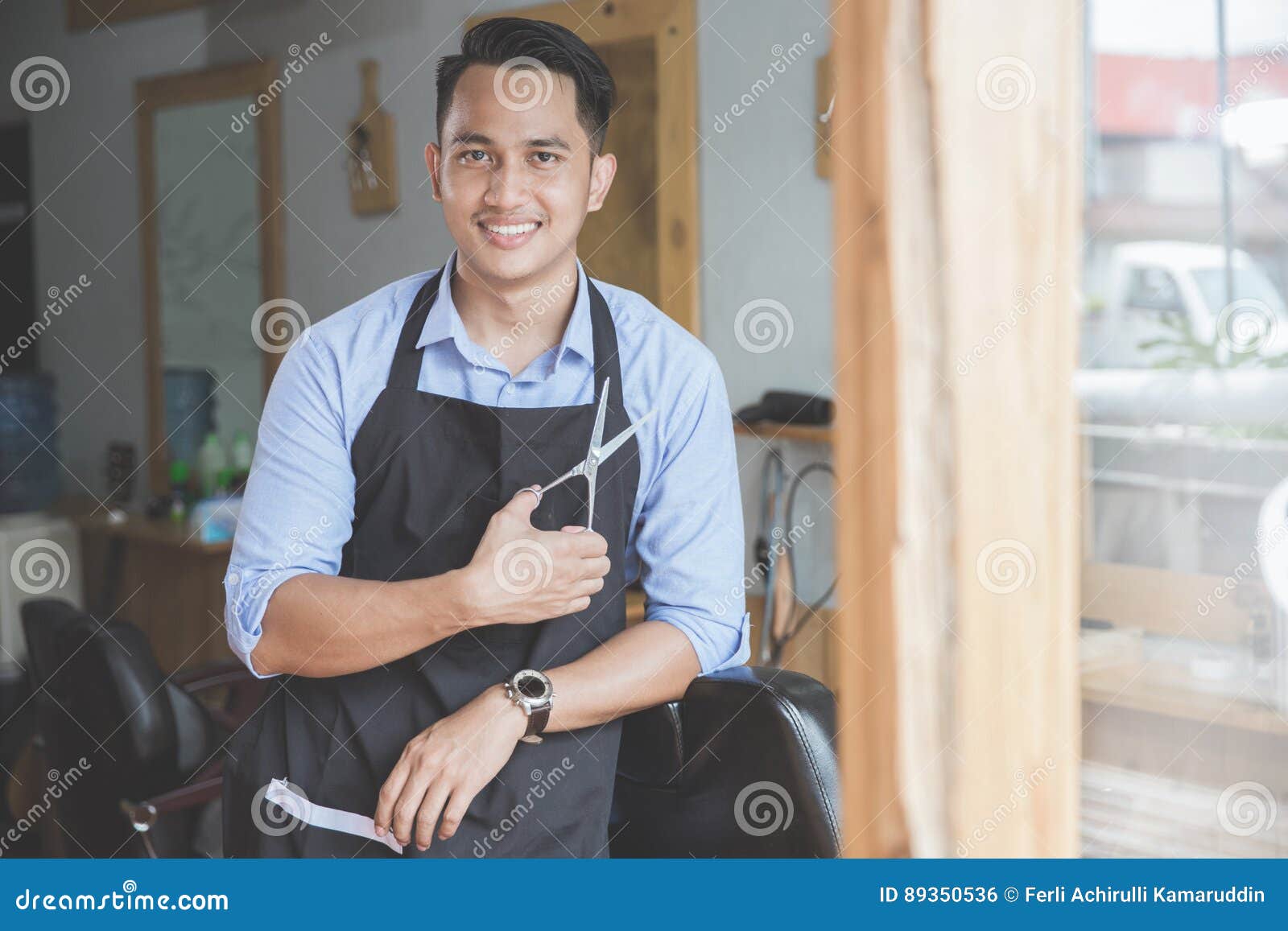 Young Barber Expert with Hair Clipper Smiling Looking at Camera Stock ... Young Barber Expert with Hair Clipper Smiling Looking at Camera Stock ...