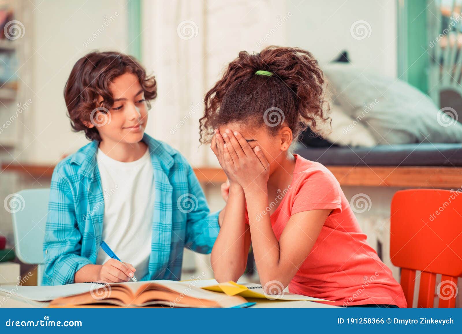 Confident Boy Cheering Up His Female Classmate Stock Photo - Image of ...